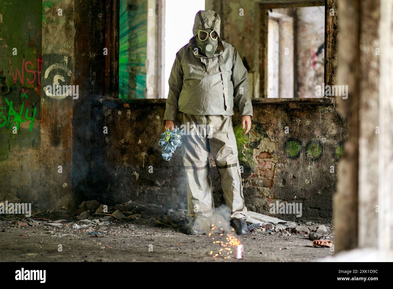 A person in a military chemical resistant suit OP1 against a background ...
