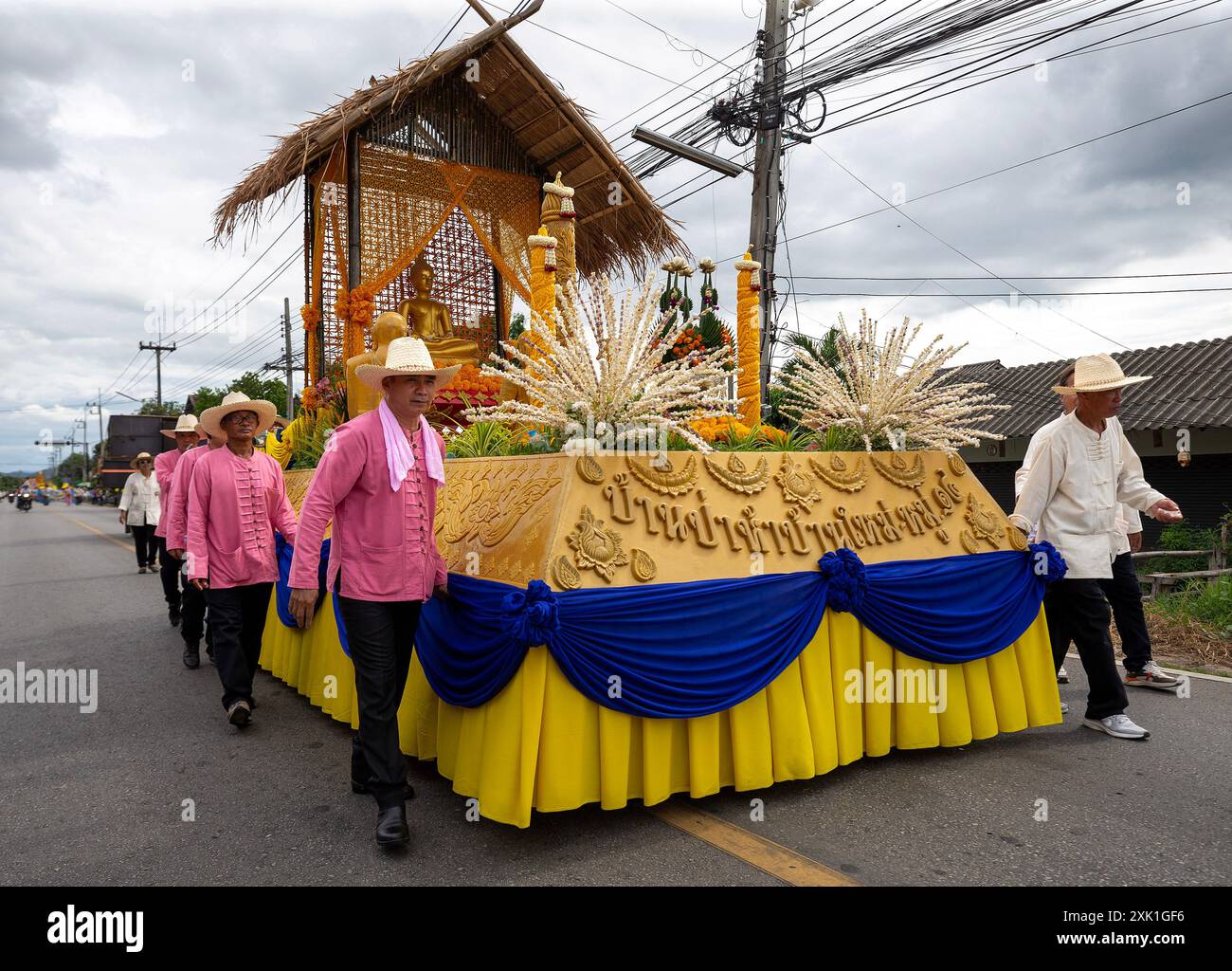 Thai villagers dressed in traditional attire seen during the candle ...