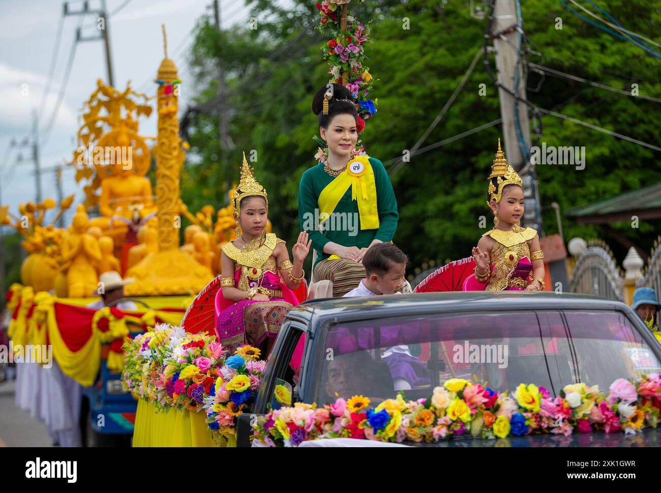 Thai villagers dressed in traditional attire seen during the candle ...