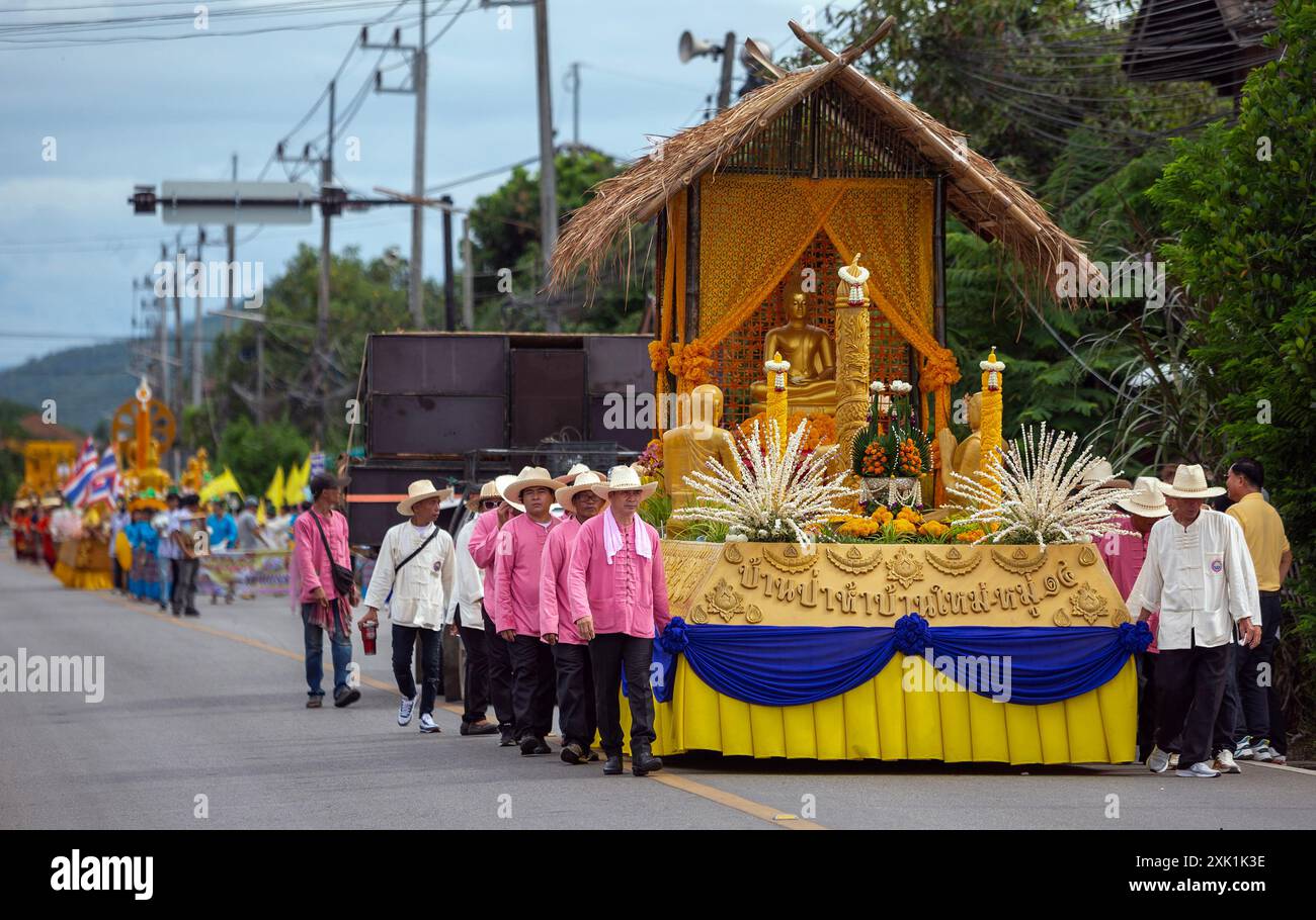 Thai villagers dressed in traditional attire seen during the candle ...