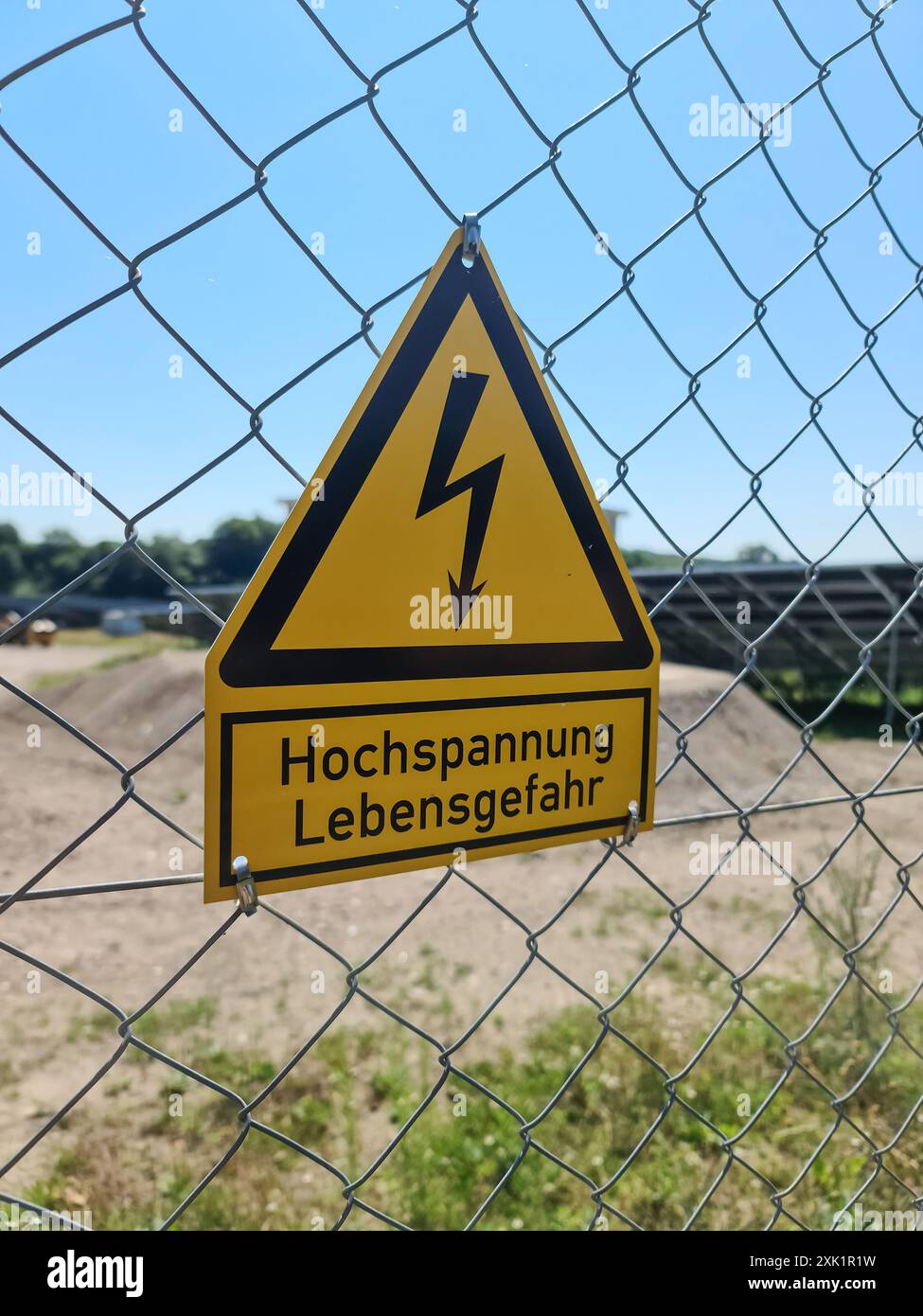 A warning sign with the German inscription for high voltage danger to ...