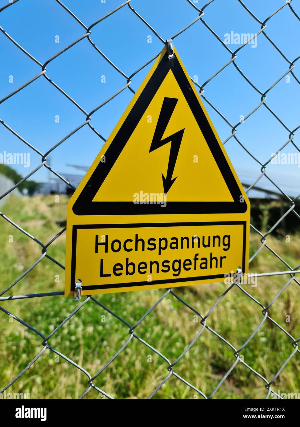 A warning sign with the German inscription for high voltage danger to ...