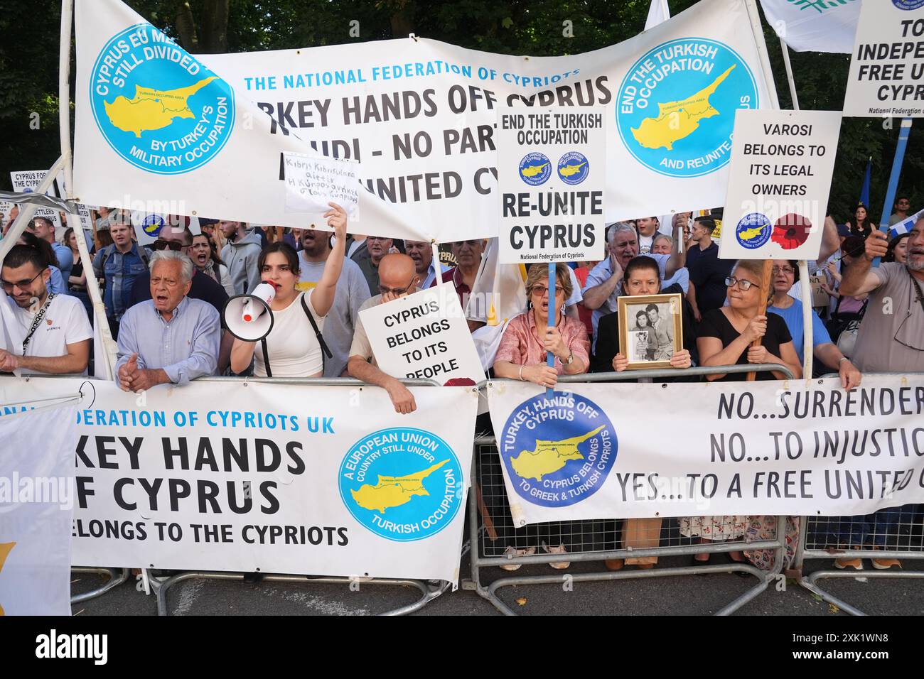 Members of The National Federation of Cypriots in the UK protest for a ...