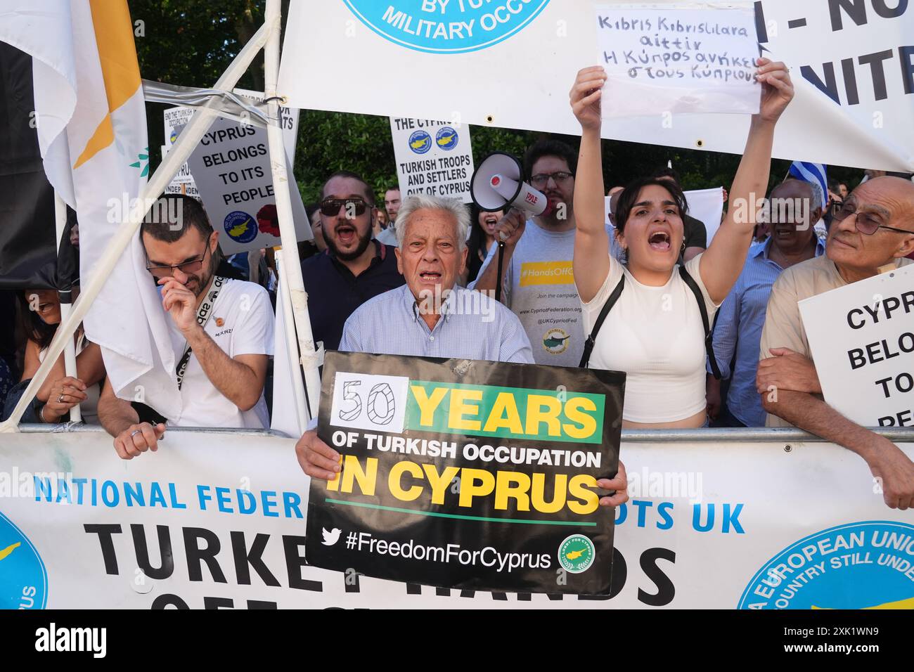 Members of The National Federation of Cypriots in the UK protest for a ...