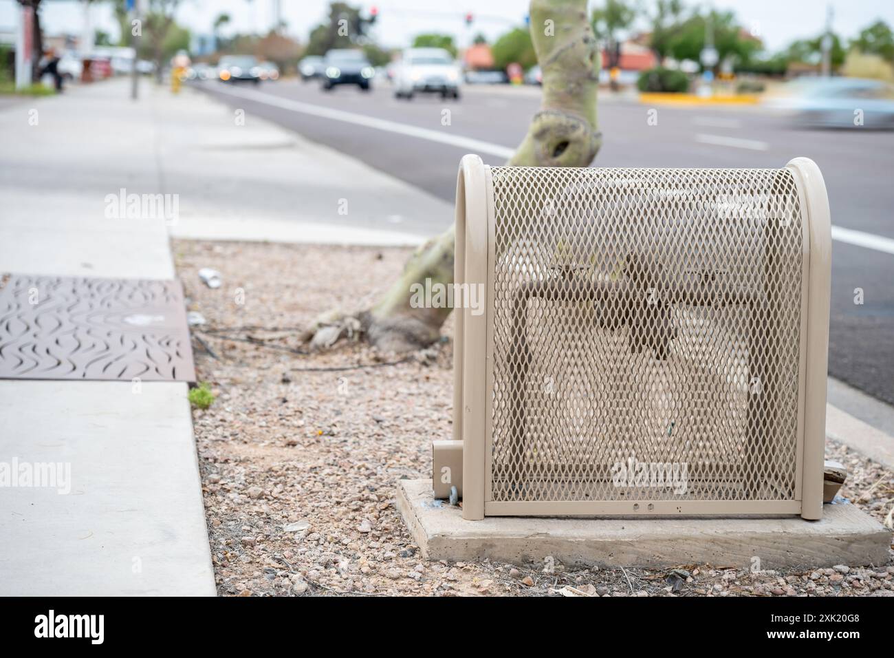 Protective cage cover placed over a utility meter to prevent tampering ...