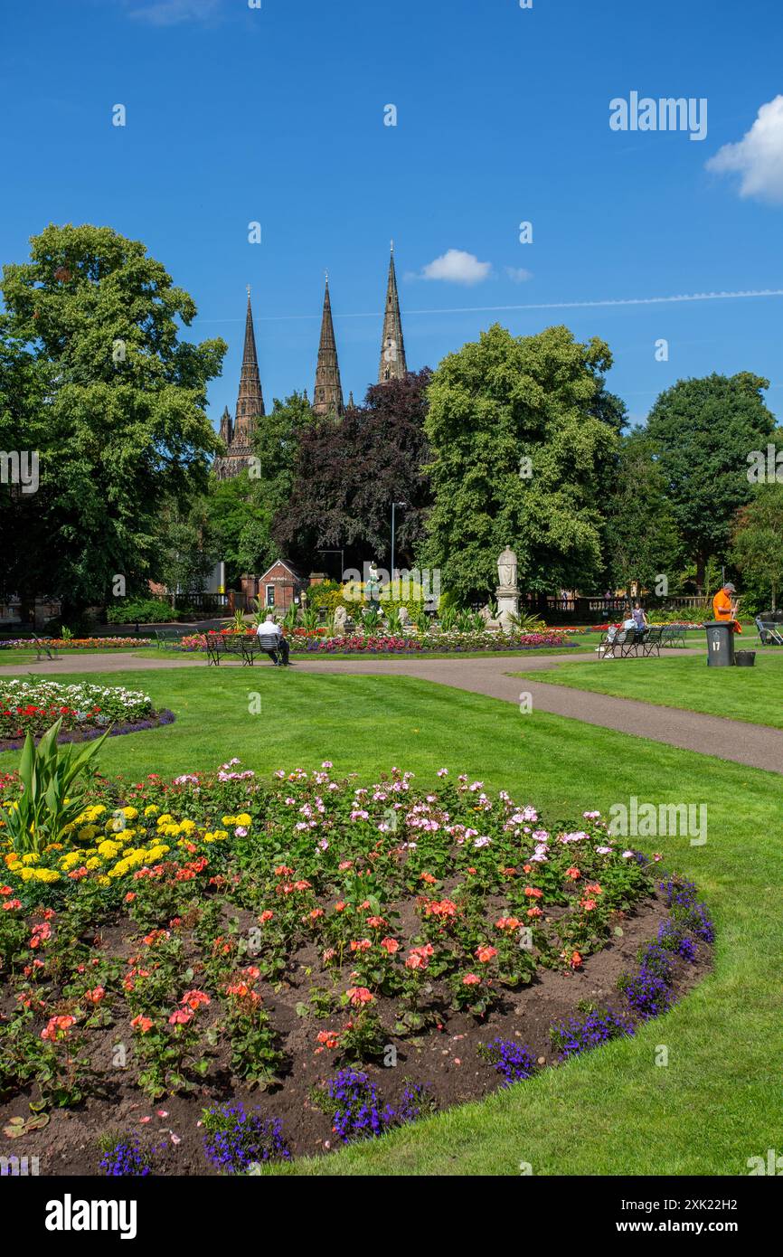 The three spires of Lichfield Cathedral seen from the summer floral ...