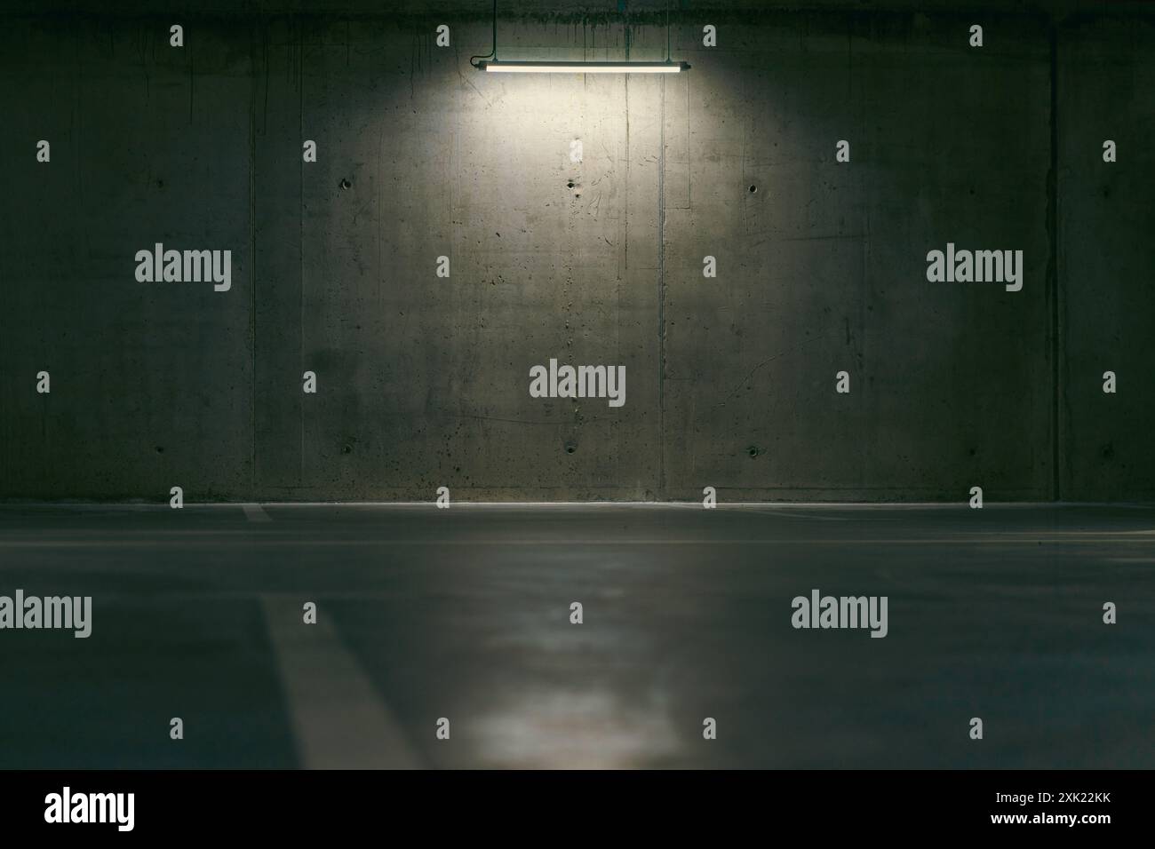 Empty underground garage. Parking lot with overhead dim light Stock ...