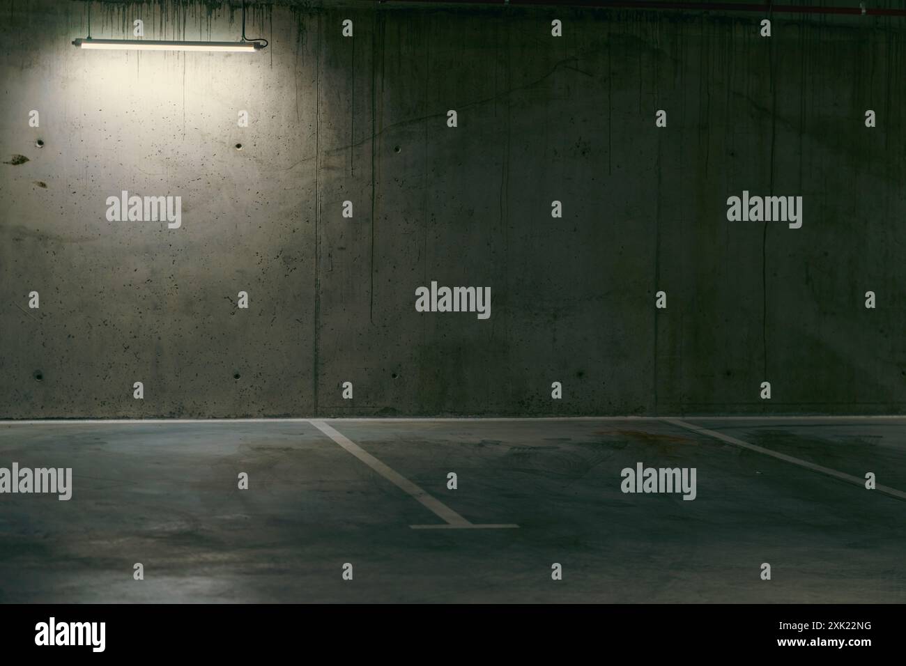 Empty underground garage. Parking lot with overhead dim light Stock ...