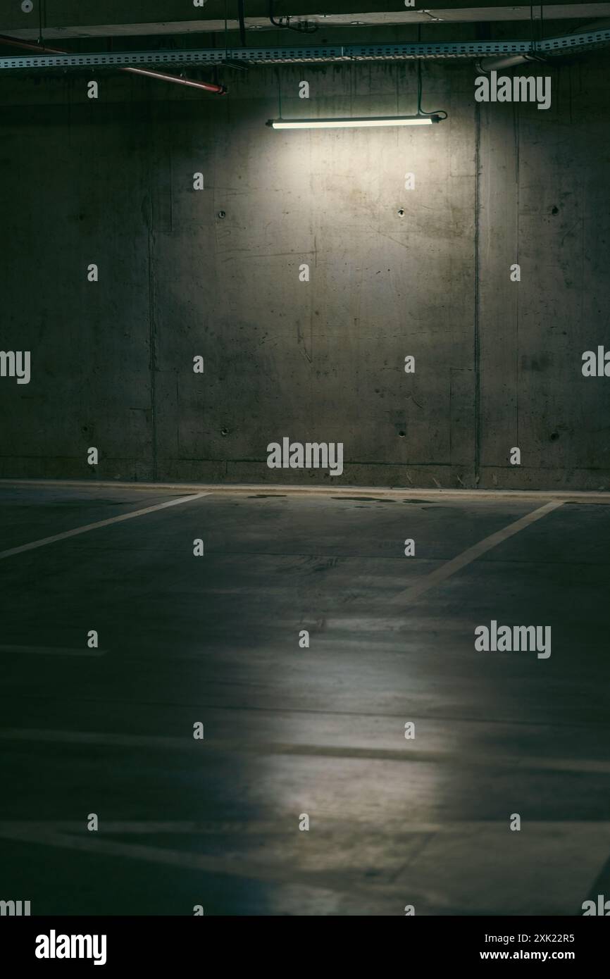 Empty underground garage. Parking lot with overhead dim light Stock ...