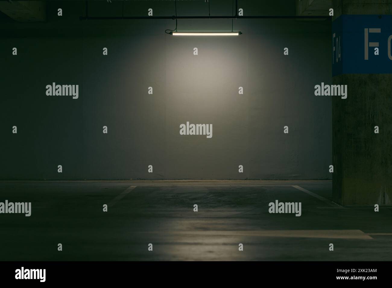 Empty underground garage. Parking lot with overhead dim light Stock ...