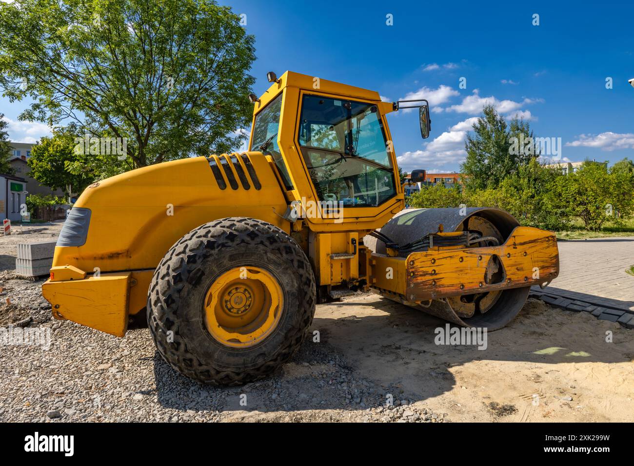 Heavy construction equipment road roller while working on road ...
