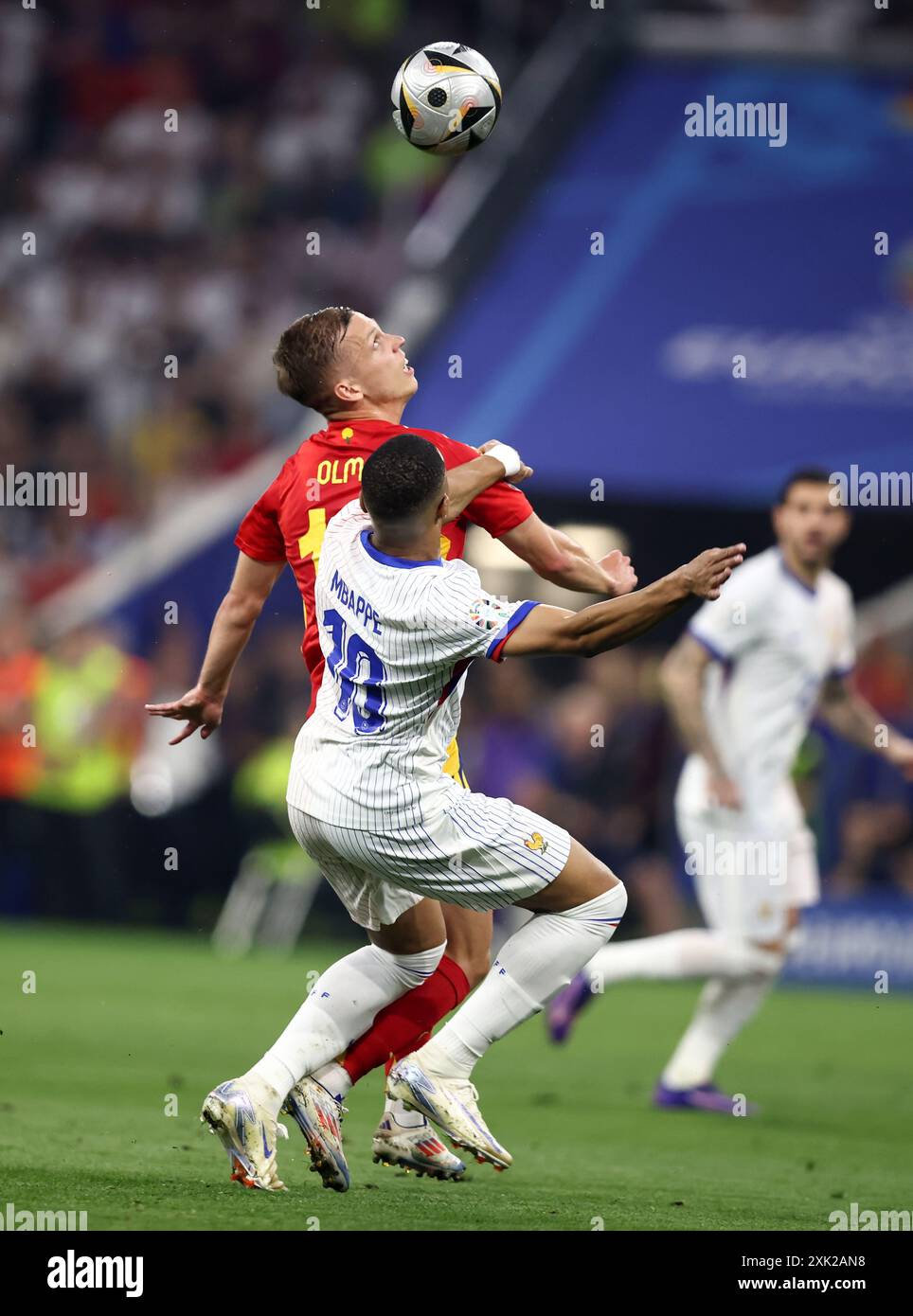 MUNICH, GERMANY - JULY 09: Dani Olmo of Spain vies with Kylian Mbappe ...