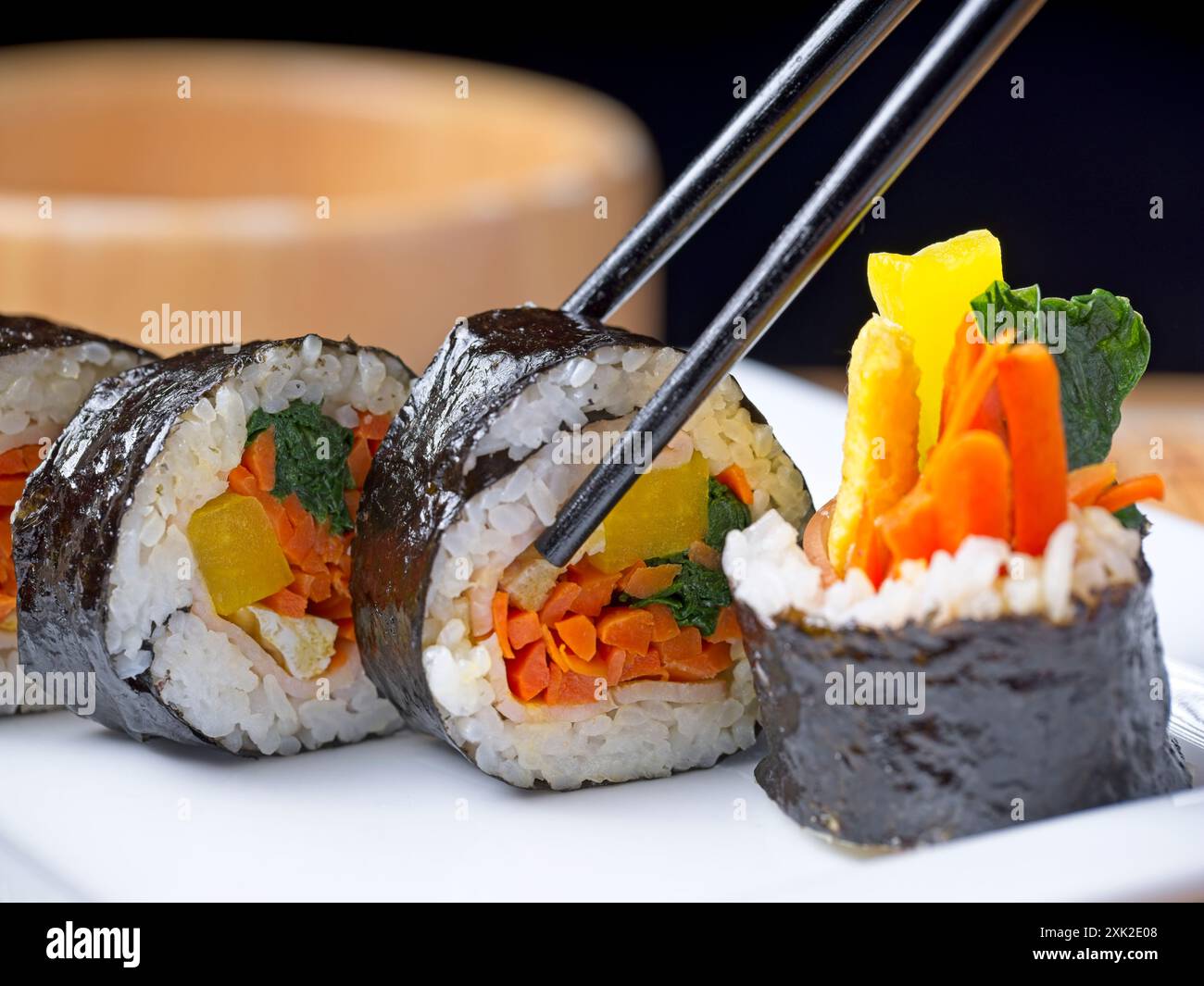 Close up studio photo of Korean kimbap slices displayed on a plate ...