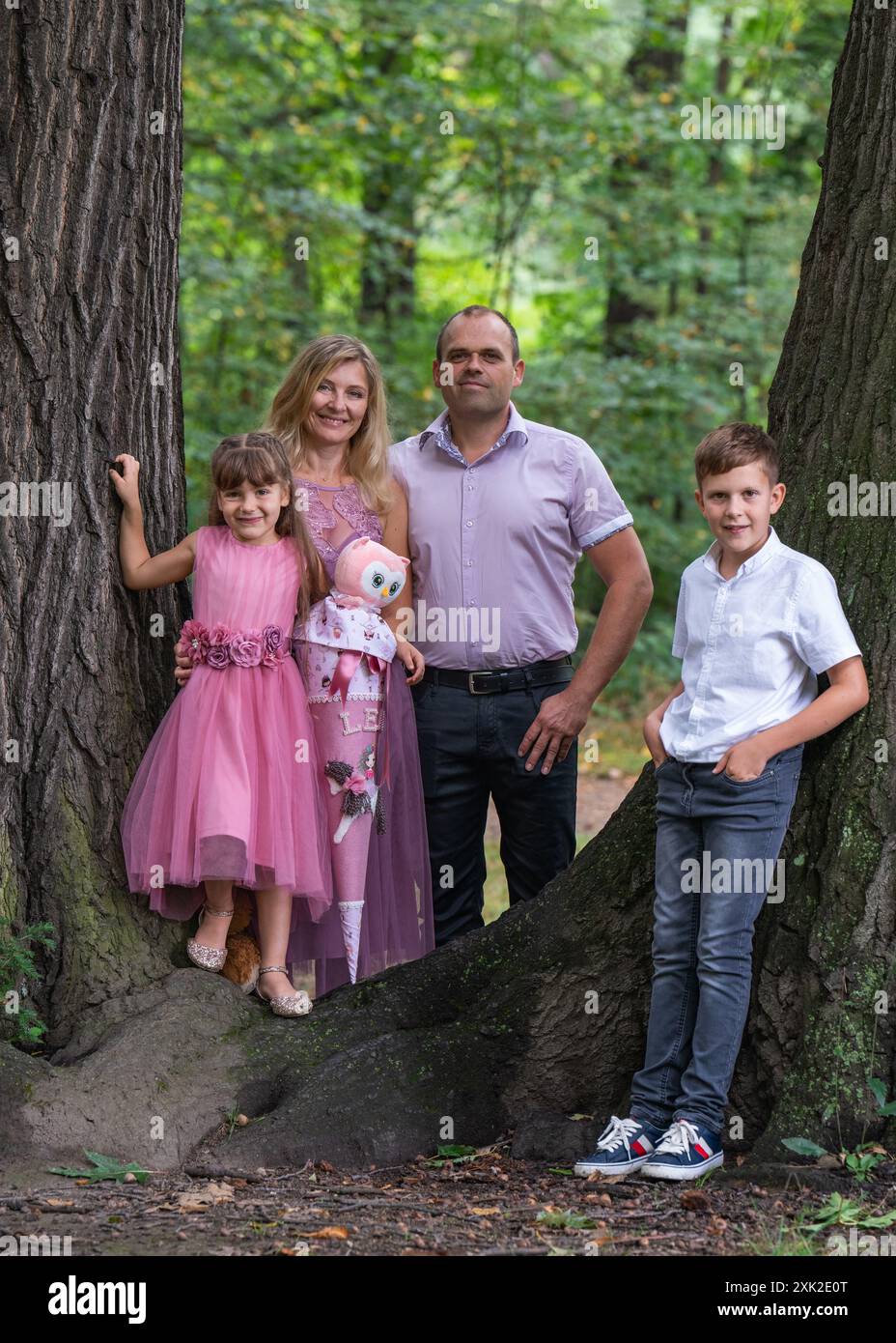 Portrait of a happy family. A laughing father and mother, a teenage son ...