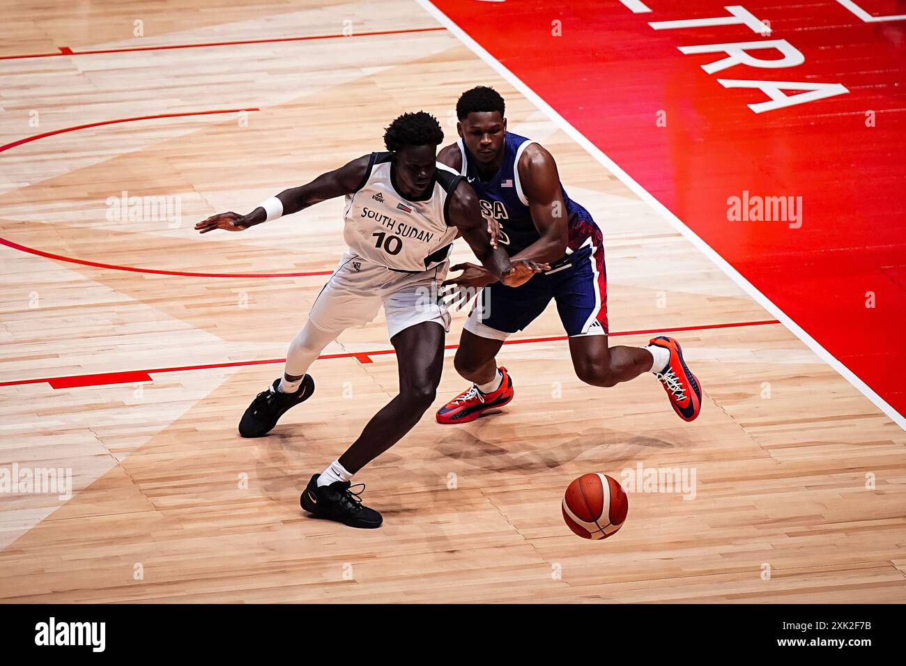 South Sudan's JT Thor and USA's Anthony Edwards battle for the ...