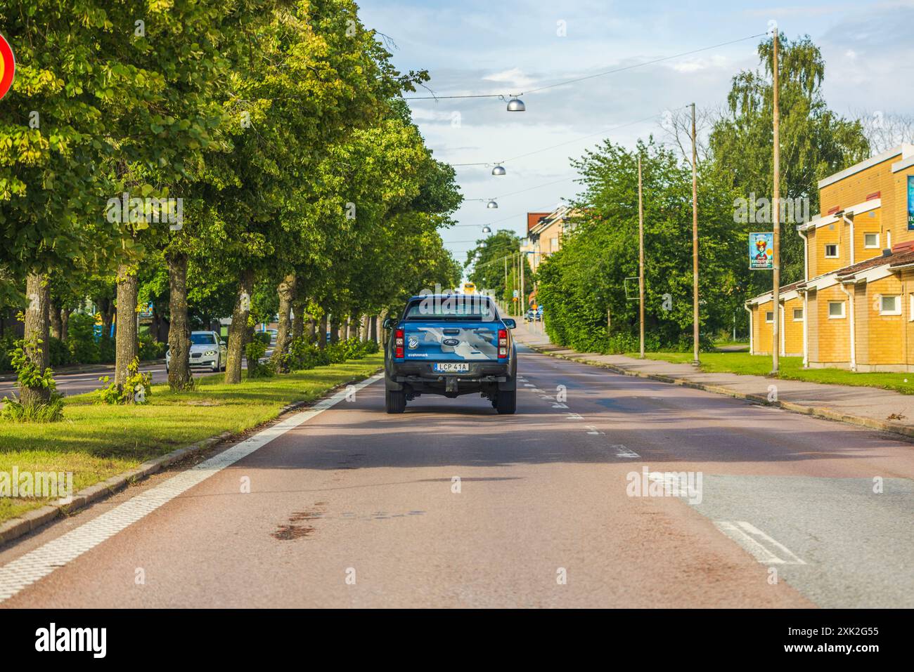 Beautiful rear view of Ford Ranger Raptor pickup truck driving ahead on ...