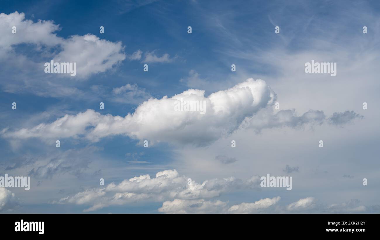 blue sky background with big and small clouds Stock Photo - Alamy