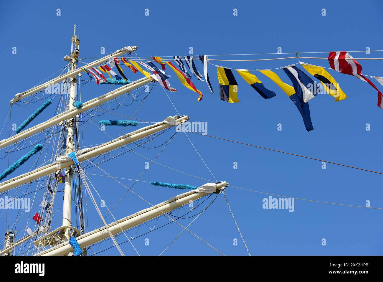 A detailed close-up view of the intricate rigging, masts, and sails of ...