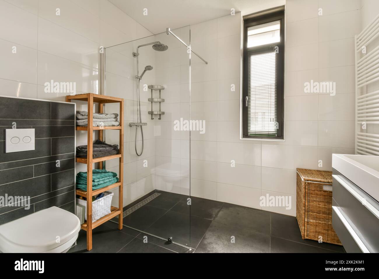 A sleek, contemporary bathroom design featuring a walk-in shower, glass ...