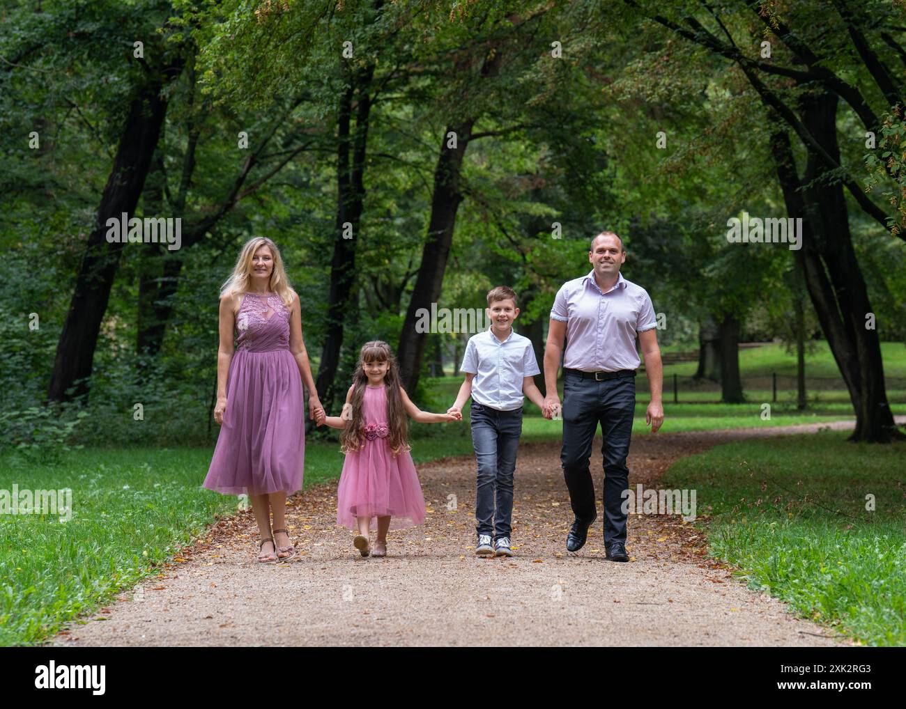 Portrait of a happy family. Laughing dad and mom, teenage son and first ...