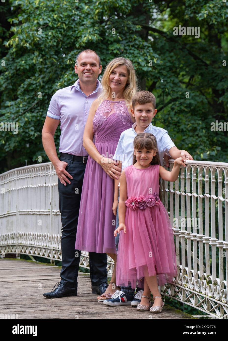 Portrait of a happy family. Laughing dad and mom, teenage son and first ...