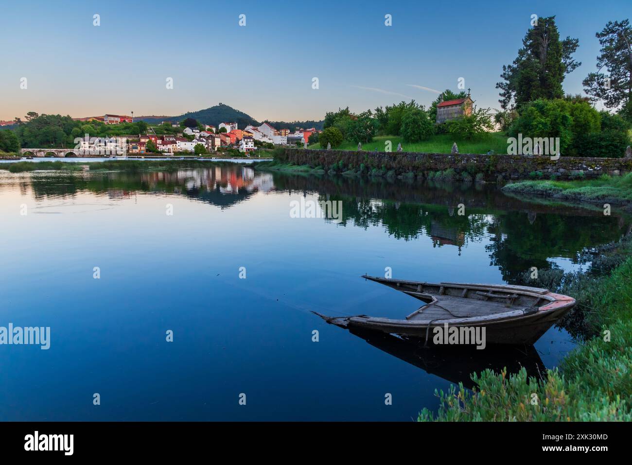 Landscape in the Rias Baixas, semi-sunken boat next to Illa Medal and ...