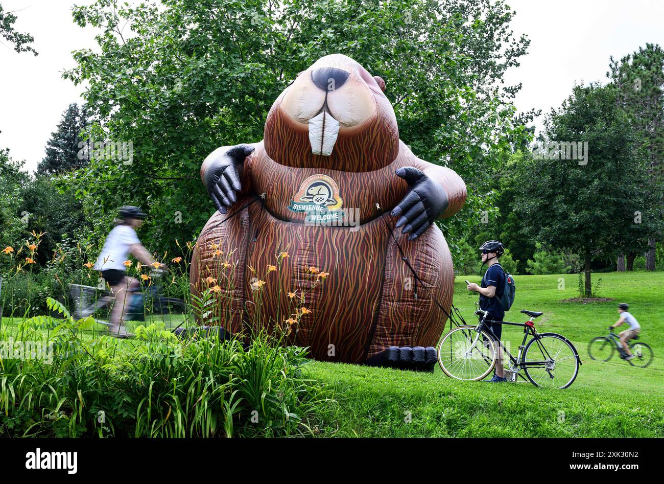 Ottawa, Can. 20th July, 2024. Cyclists pass Parks Canada's giant ...