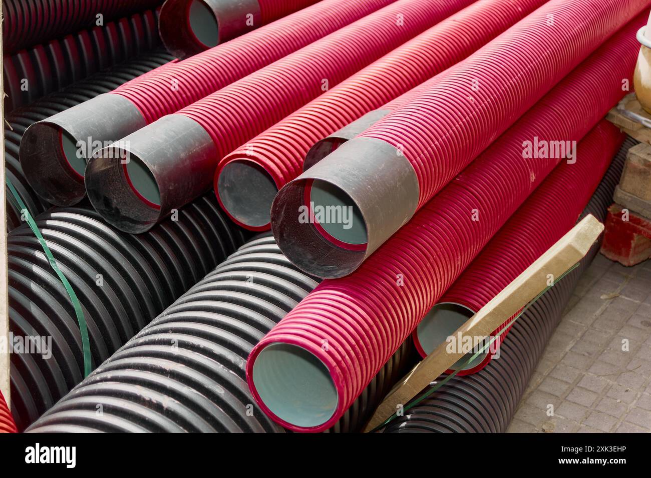 Photograph of stacked construction pipes, showing the intersection of ...
