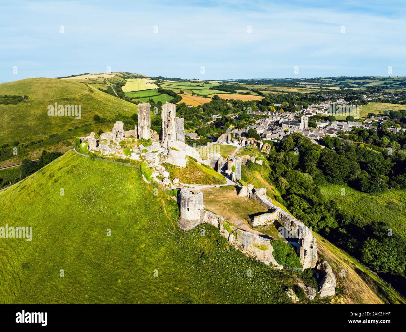 Ruins of Corfe Castle from a drone, Corfe Village, Purbeck Hills ...
