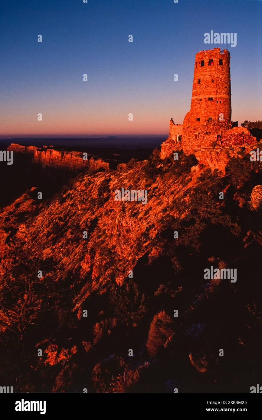A view at sunset of the Desert View Watchtower, a 70-foot-high stone ...