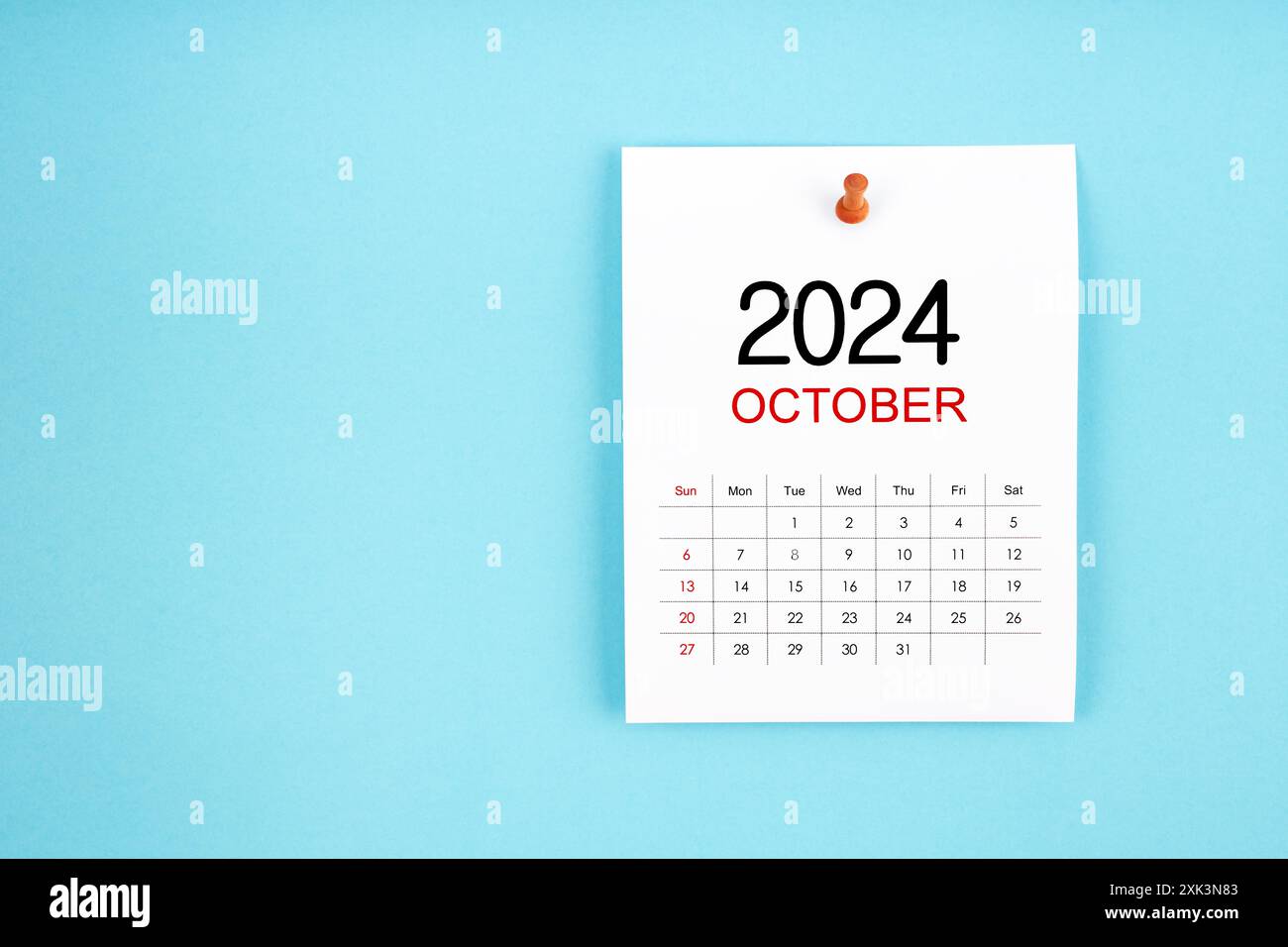 October 2024 calendar page with push pin on blue color background Stock ...