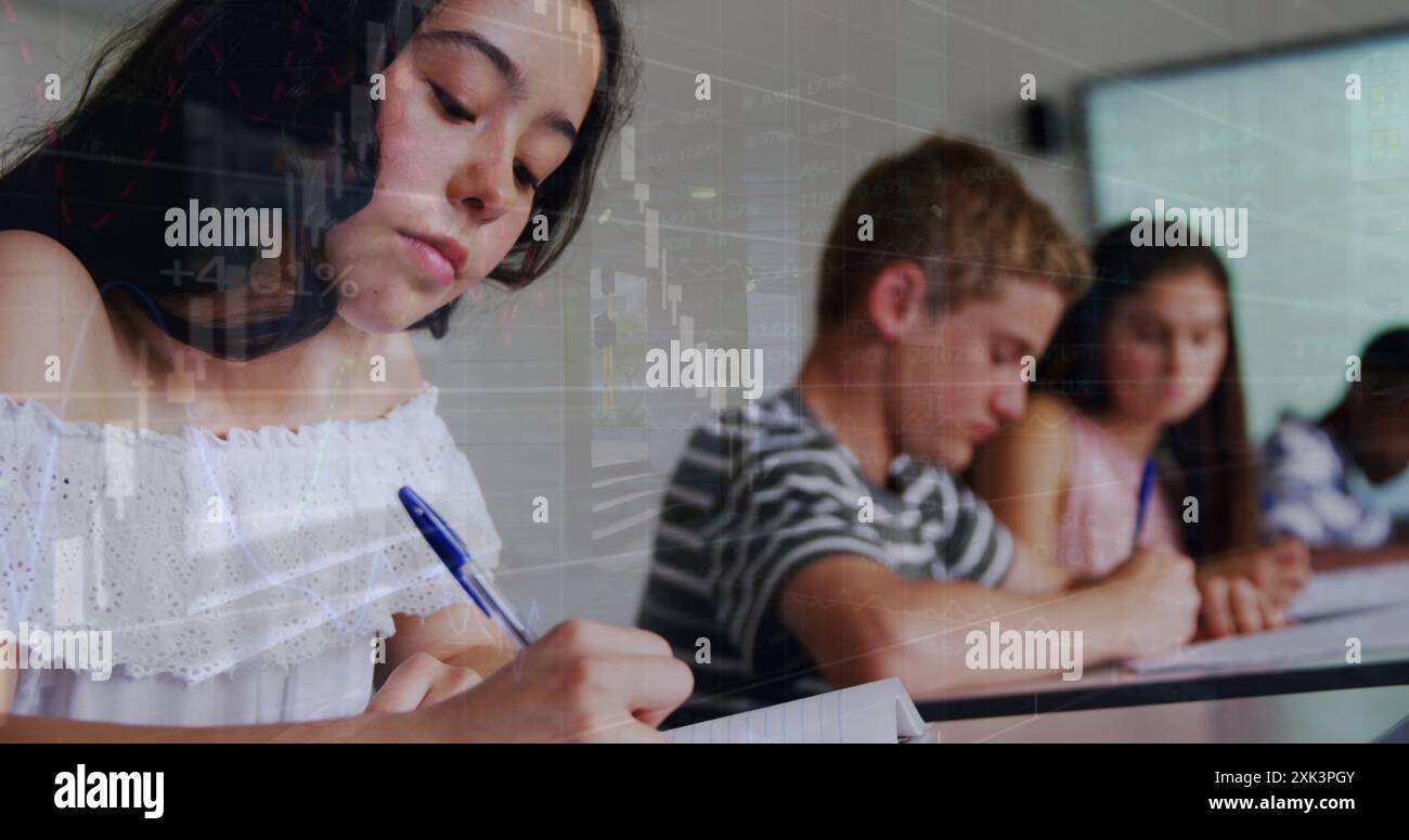 Image of graphs over diverse pupils learning at school Stock Photo - Alamy