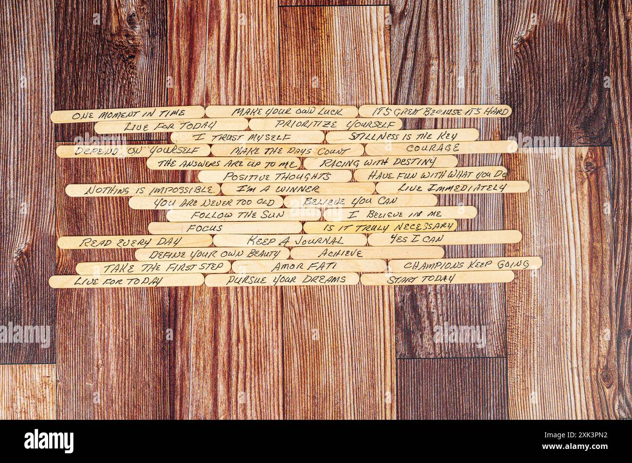 Inspirational sayings on popsicle sticks on wood plank background Stock ...