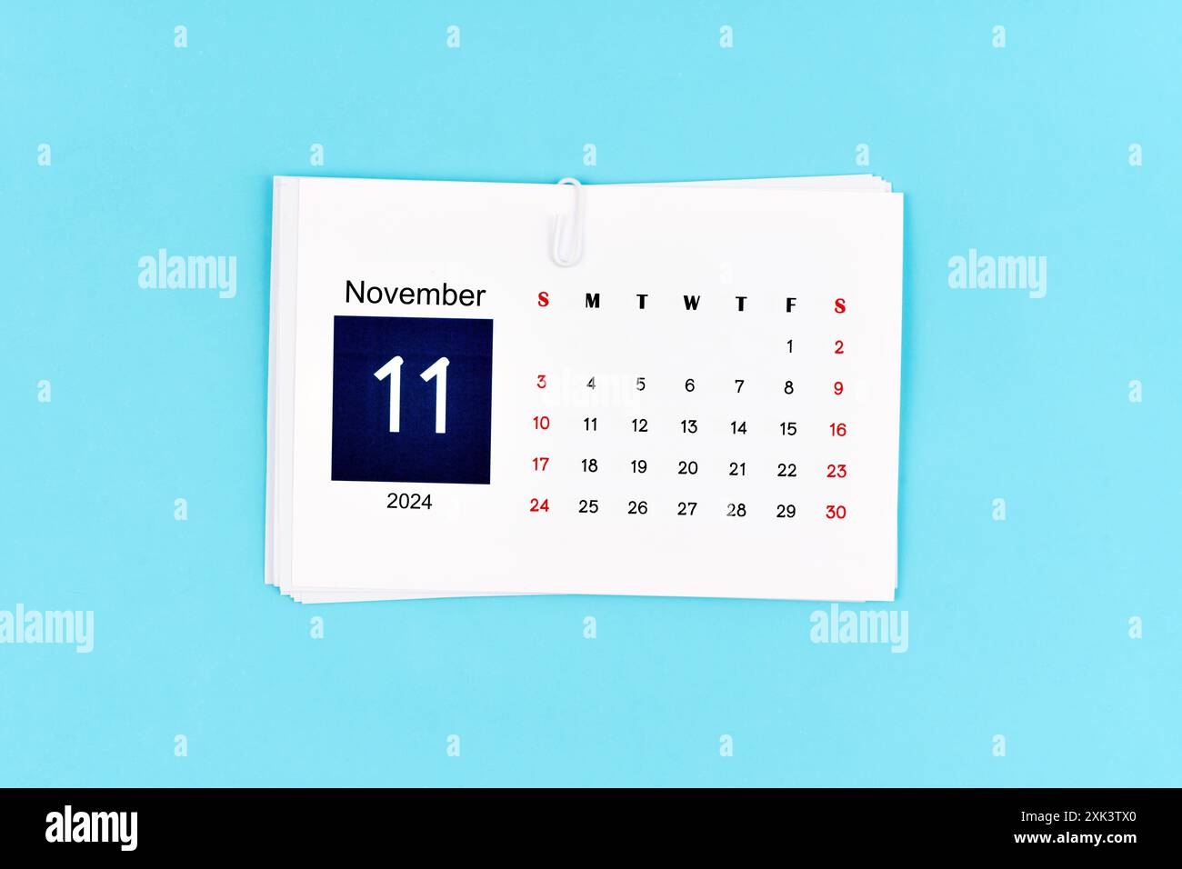 November Calendar 2024 page on blue color background Stock Photo - Alamy
