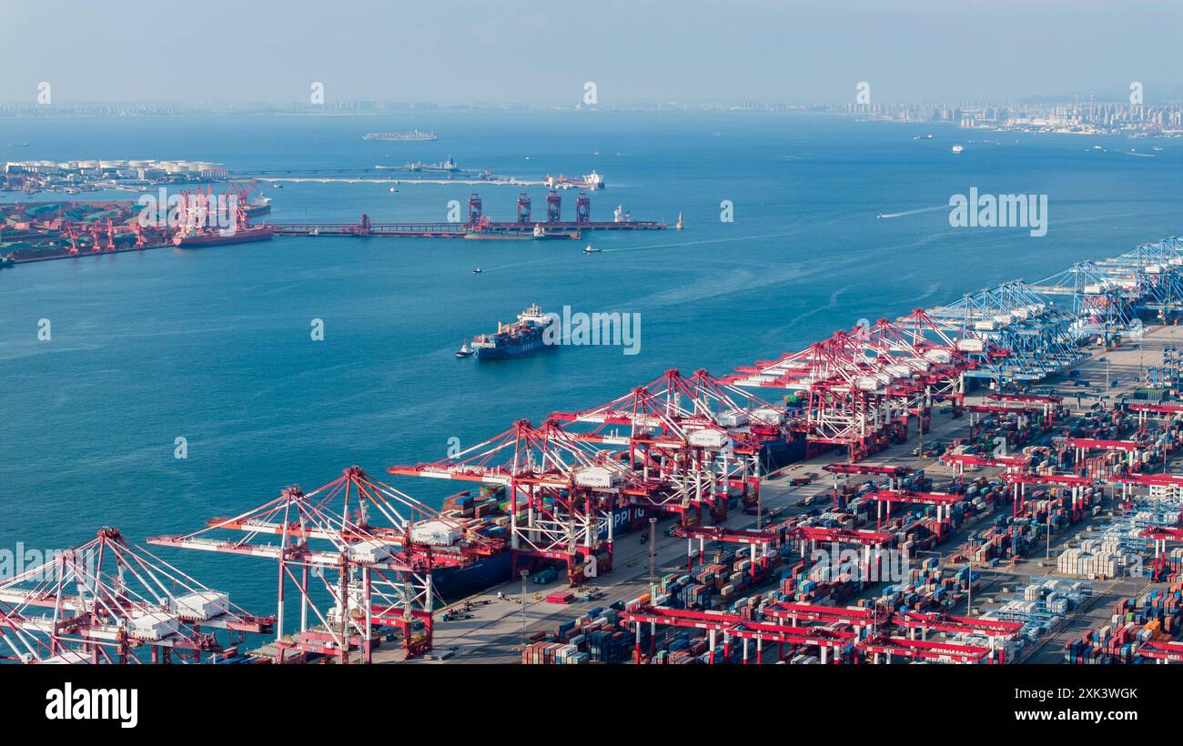 QINGDAO, CHINA - JULY20, 2024 - The container loading and unloading operation at Qianwan ...