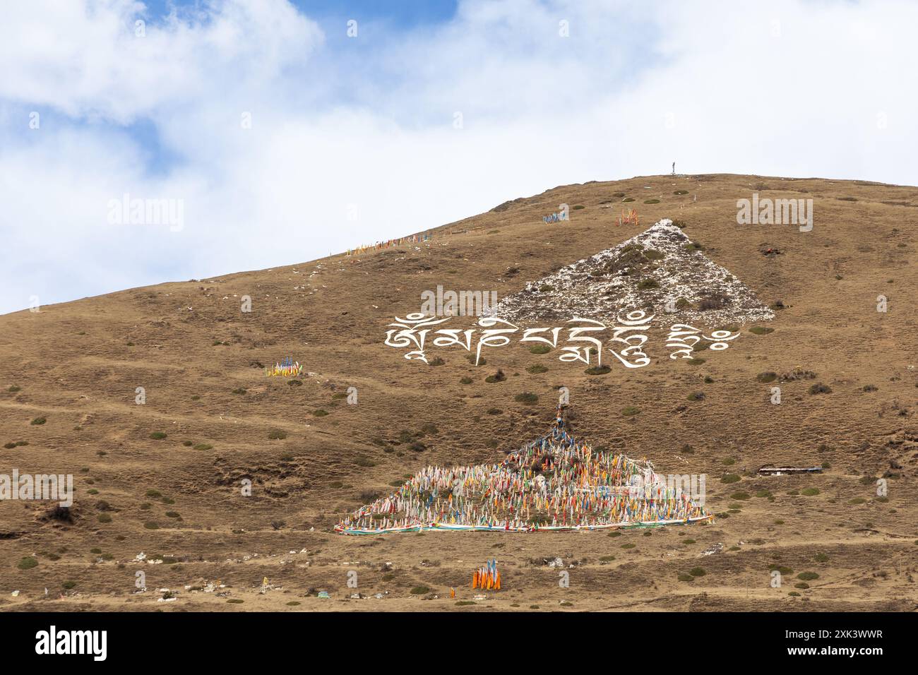 Tibetan language Om Mani Padme Hum mantra is inscripted onto the hill ...