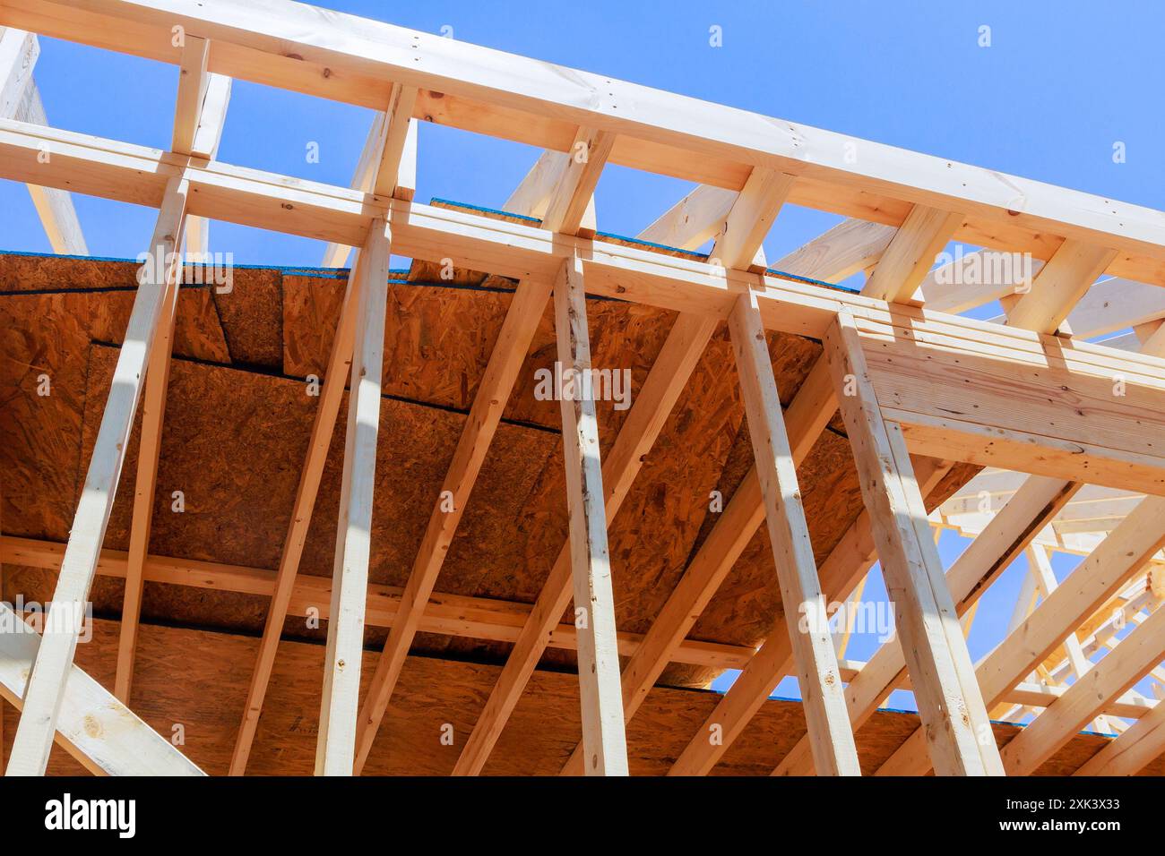 Wooden frame beam is used for framing during construction of new home ...