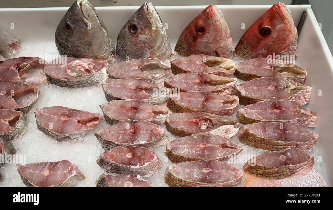 Raw slices of fish displayed in supermarket. Fresh seafood concept ...