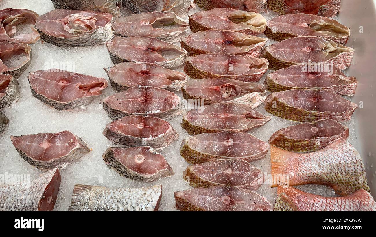 Raw slices of fish displayed in supermarket. Seafood background Stock ...