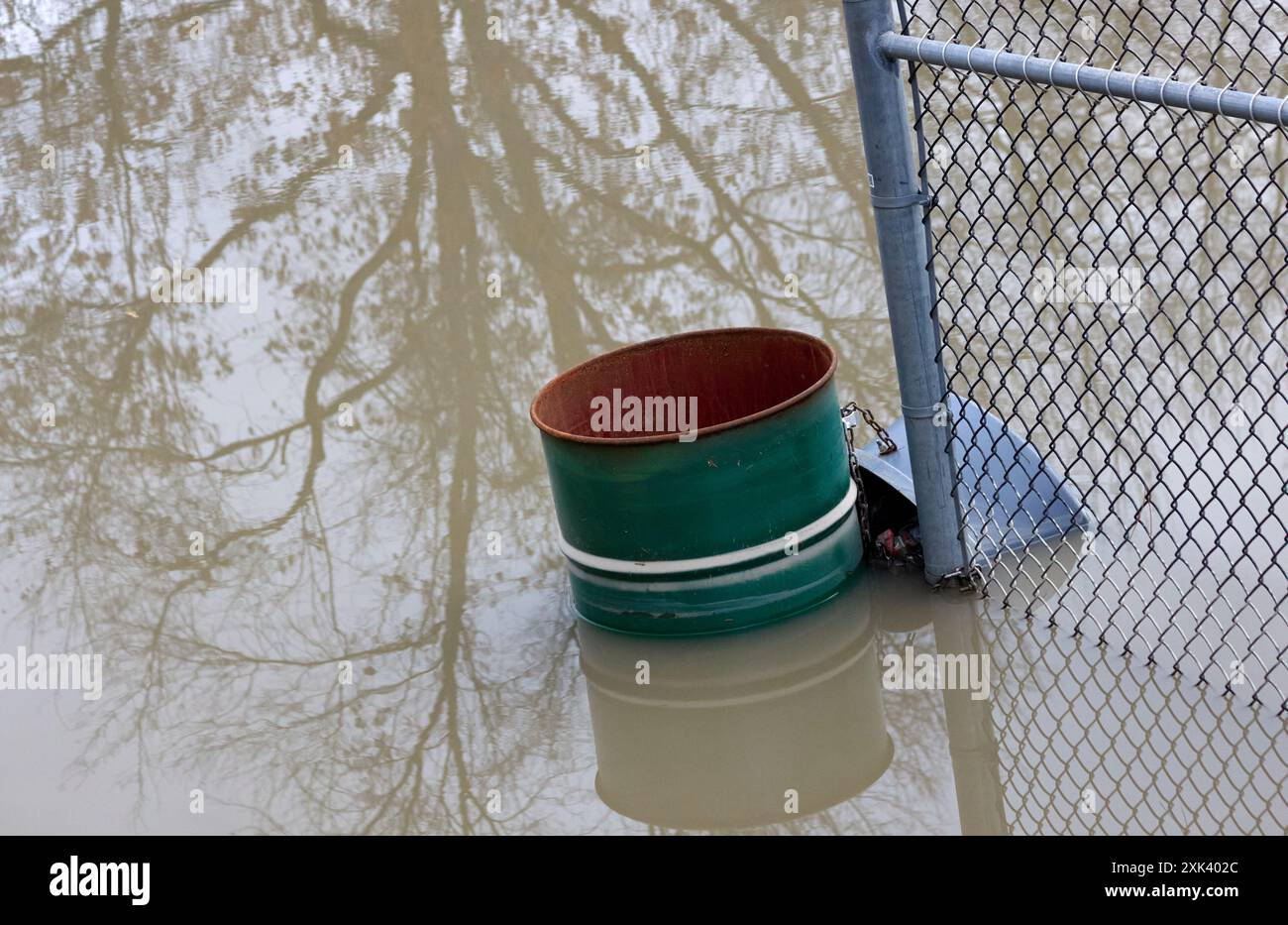 A garbage can is surrounded by flooded waters Stock Photo - Alamy