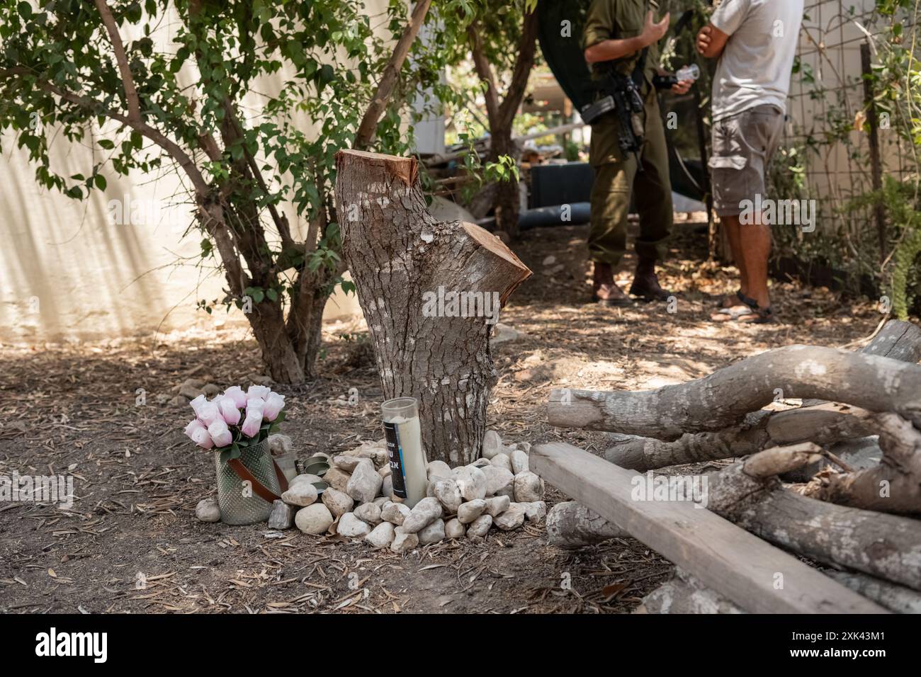 July 18, 2024, Kfar Aza, Israel: A soldier and a tourist have a chat ...