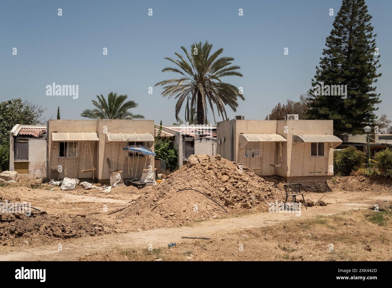 July 18, 2024, Kfar Aza, Israel: Soil piles moved in order to search ...