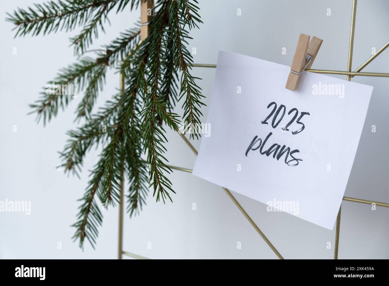 2025 PLANS text on white paper note on vision board with Christmas ...