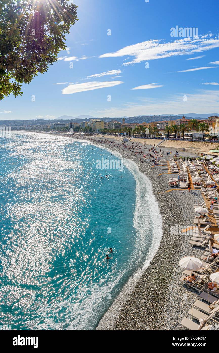 Late afternoon sun over the popular pebble beaches along Promenade des ...
