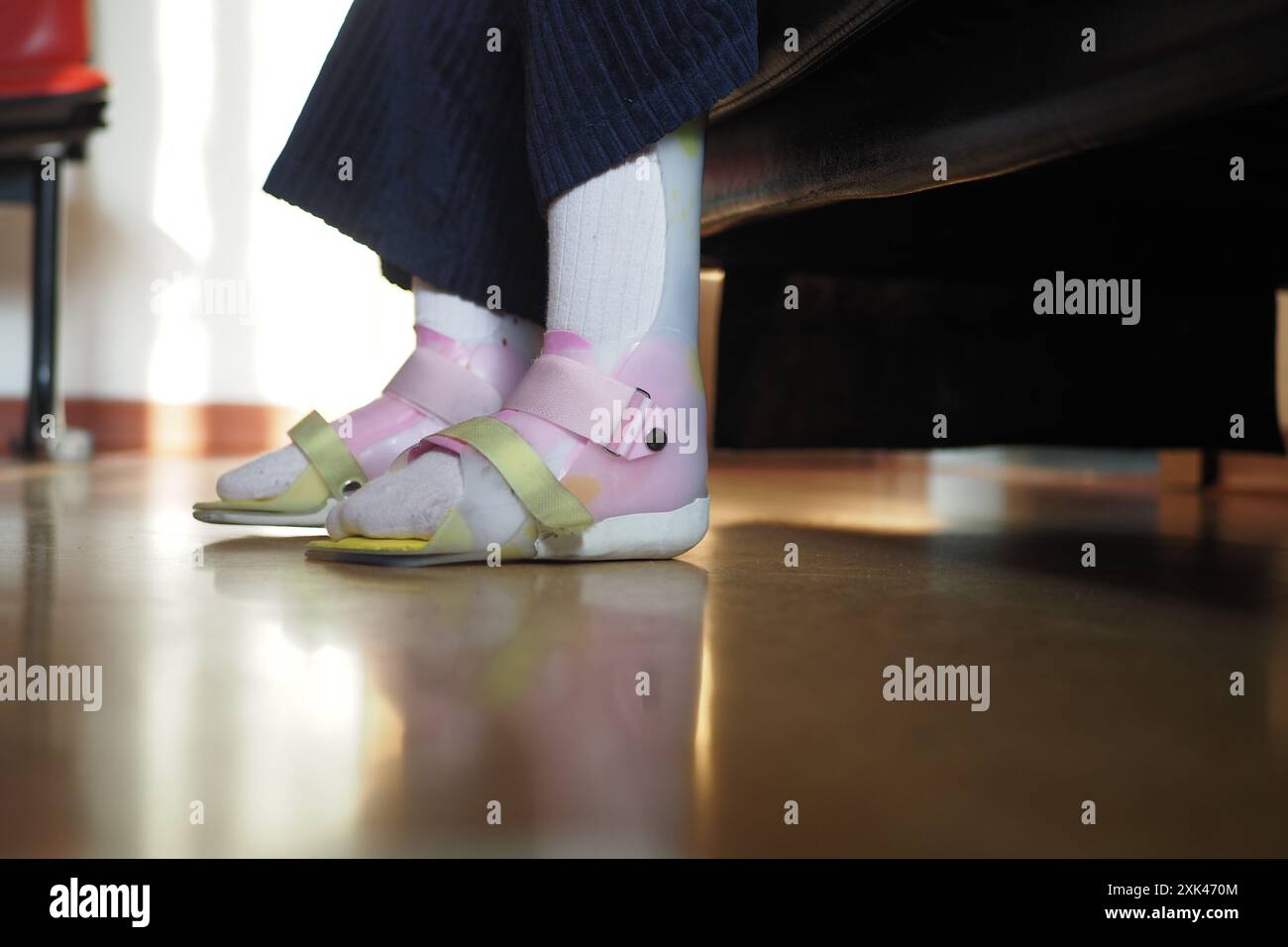 Child cerebral palsy disability, legs orthosis Stock Photo - Alamy