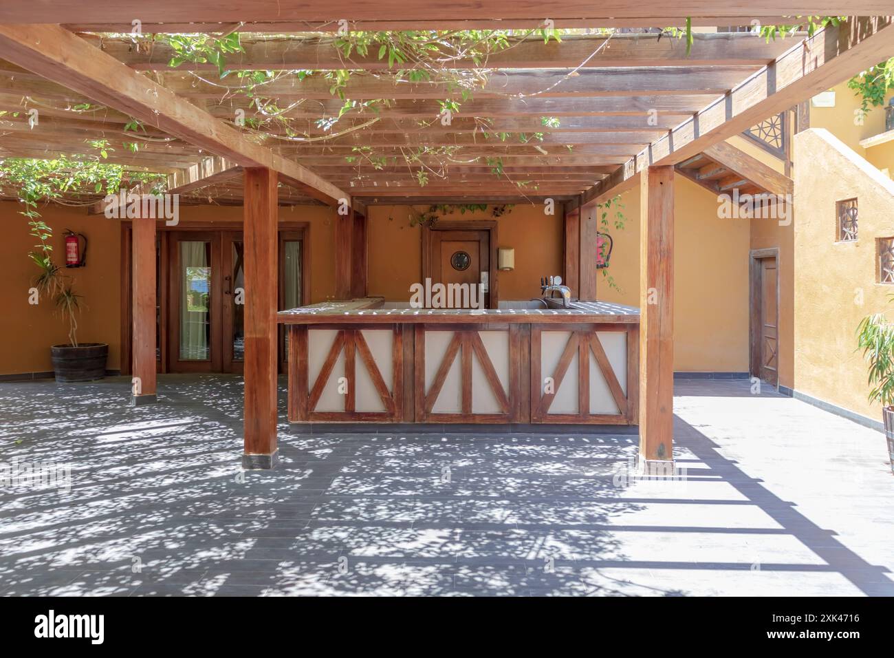 Outdoor bar with wooden pergola and plants Stock Photo - Alamy