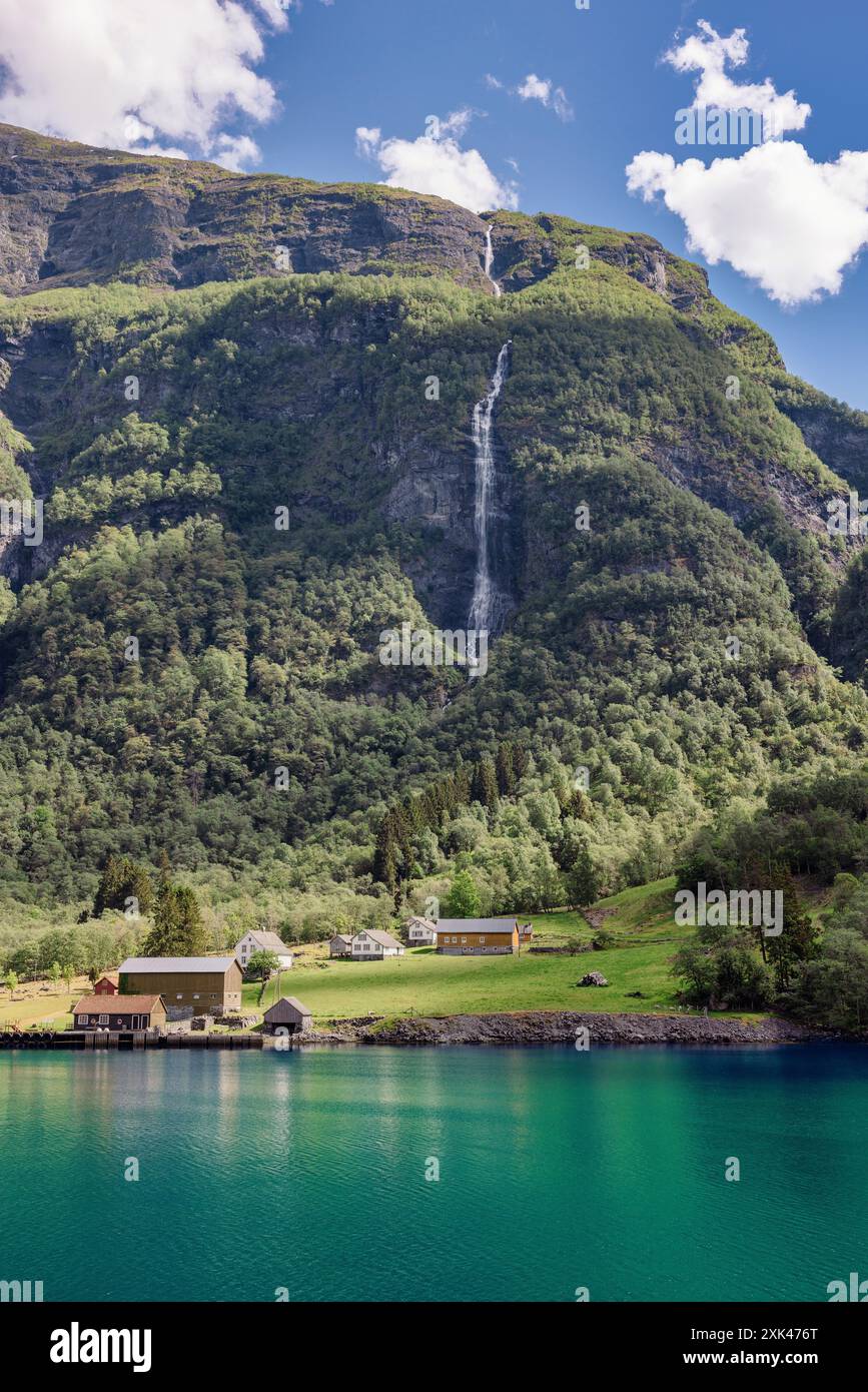 A stunning view of Hardanger fjord in Norway with lush green mountains ...