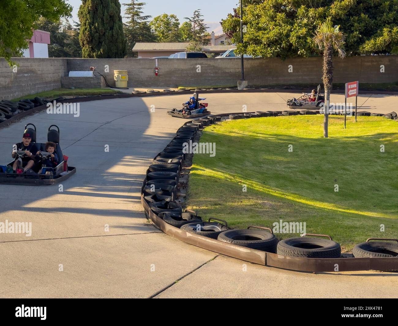 Santa Maria, California, USA - July 20, 2024. People enjoying a go-kart ...