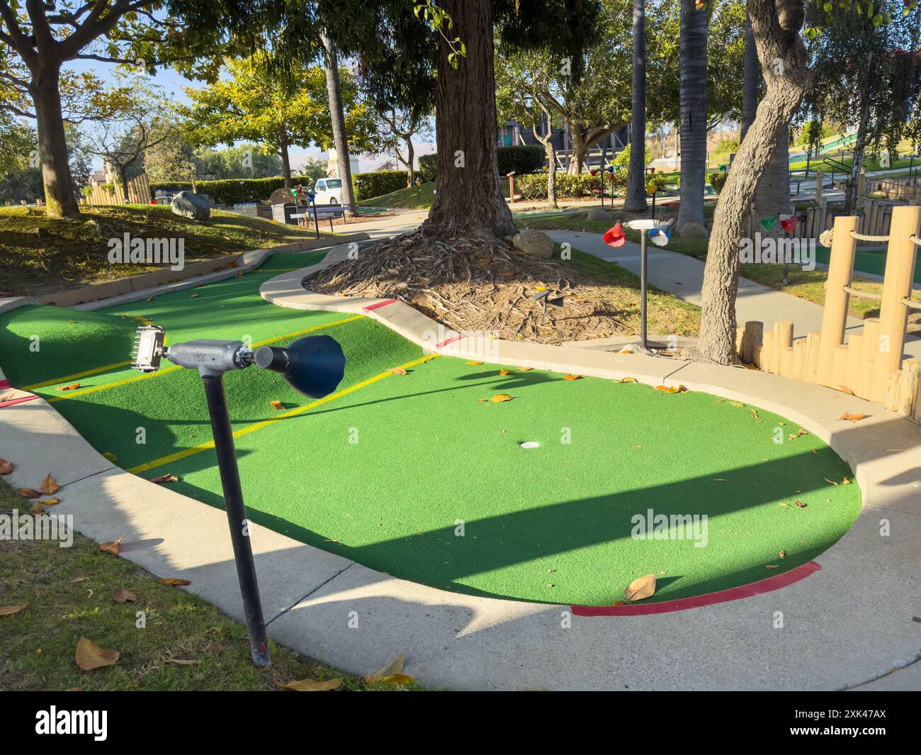 Colorful mini-golf course features various holes and playful challenges ...