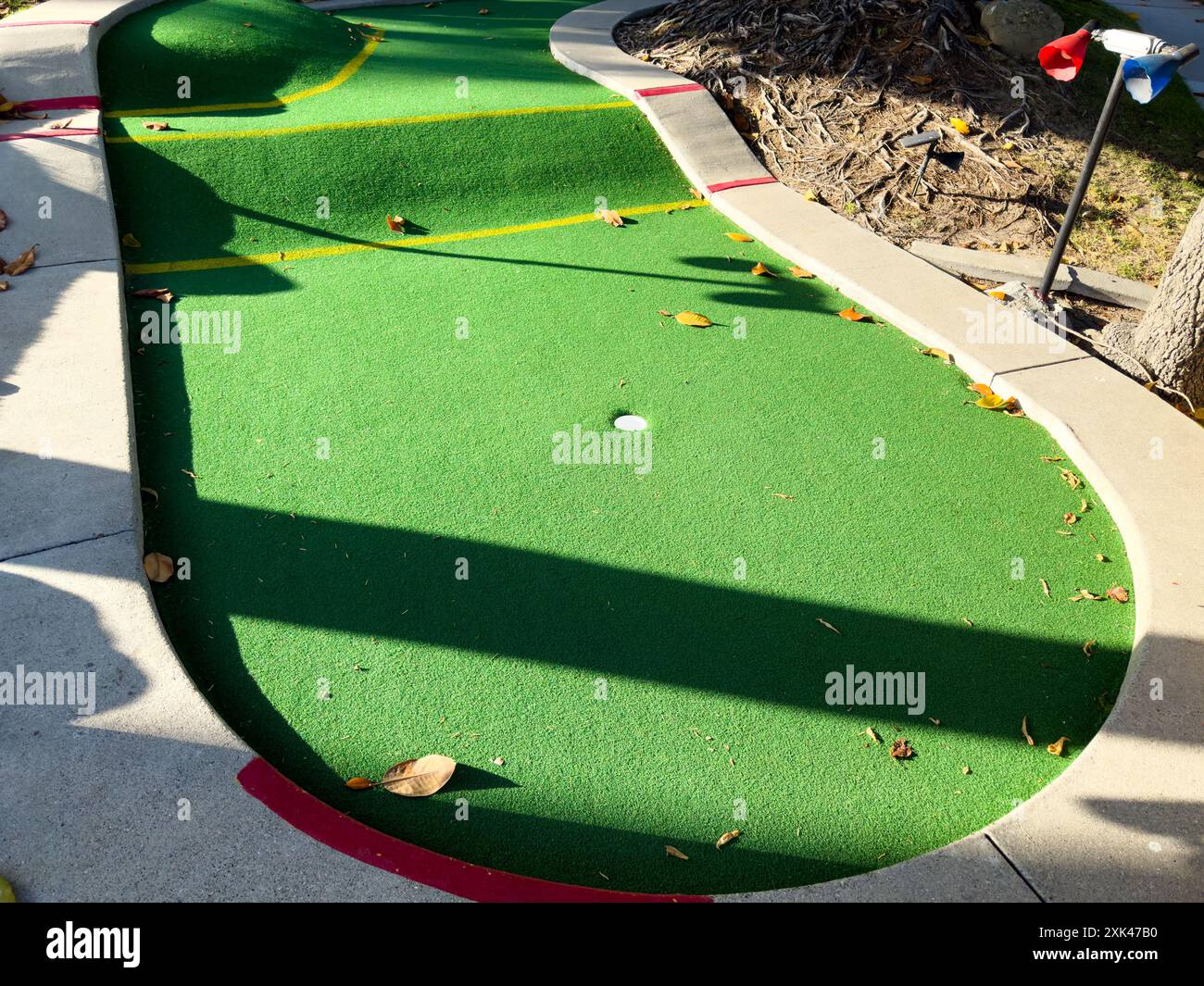 Colorful mini-golf course features various holes and playful challenges ...